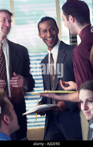 Business people talking in board room Stock Photo - Alamy