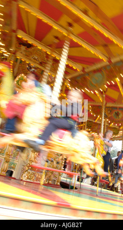Carousel Merry go round blurr Stock Photo - Alamy