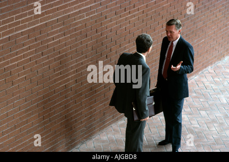two businessmen talking in the office Stock Photo - Alamy
