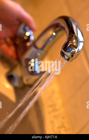 Turning off a kitchen water tap Stock Photo: 3016245 - Alamy