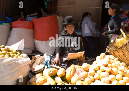 Aymara people and a food stall in the market district of La Paz ...