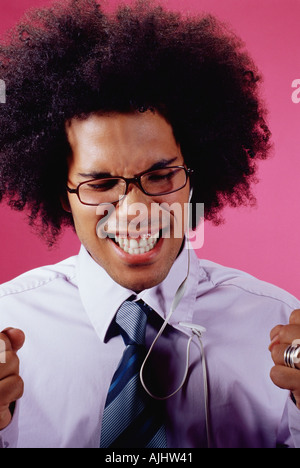 Black man celebrating success clenching fists feeling satisfaction ...