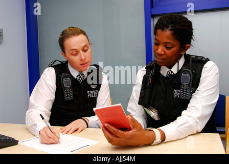 Female Special Police Officers writing up witness statement at Kingston ...
