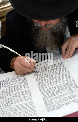 Religious Jewish men carry the Torah back to the holy ark during ...