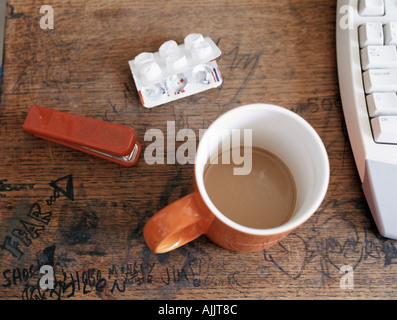 Tablet computer with stationery and cup of coffee on color background ...