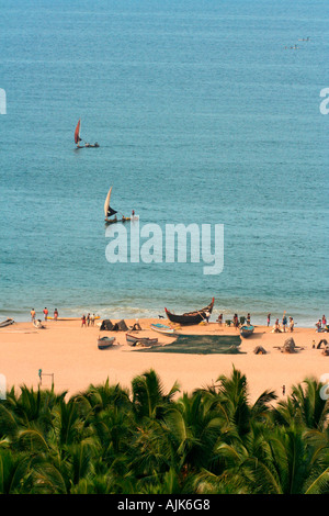A vertical top shot of foamy waves covering some stones Stock Photo - Alamy