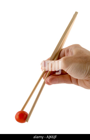 Close-up of chopsticks holding a cut open Chinese pork and shepherd's ...