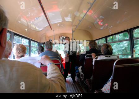 Passengers and conductor on a restored 1959 Leyland Tiger Cub King ...