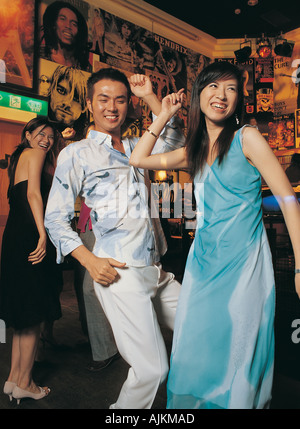 Young couple dancing in a bar Stock Photo - Alamy