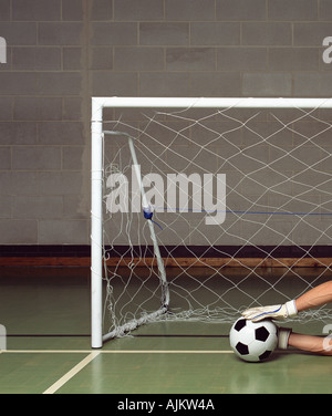 Soccer goalkeeper saving football Stock Photo - Alamy