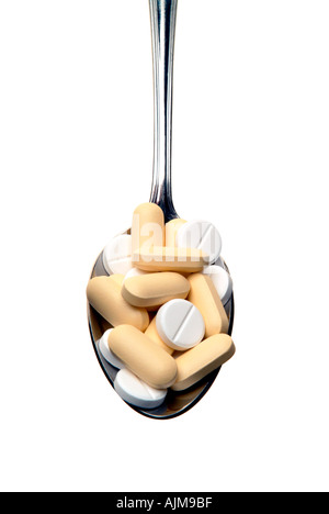 a spoon with tablets Stock Photo - Alamy