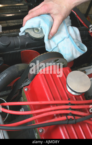 Mechanic topping up fluid Stock Photo - Alamy