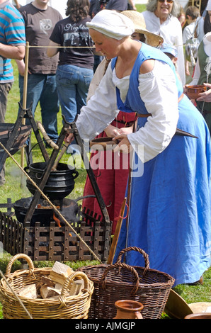 Entertainer dressed as a Medieval Serving wench taking part in a feast ...
