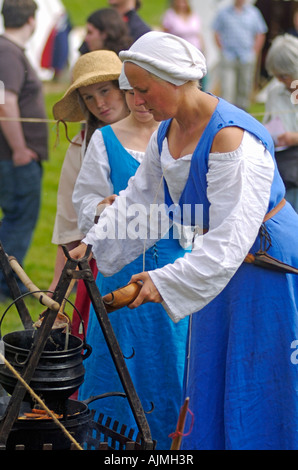 Entertainer dressed as a Medieval Serving wench taking part in a feast ...
