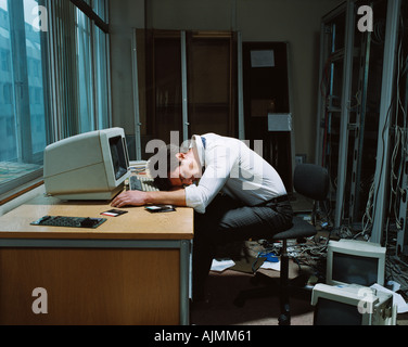 Office worker dead at his desk Stock Photo - Alamy