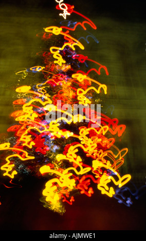 christmas tree and abstract blurred lights on background. Blue, purple ...