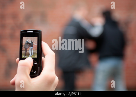 two fighting boys are being recorded by mobile phone Stock Photo - Alamy