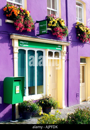 The Irish Post Office (Oifig an Phoist) logo on a sign outside the ...