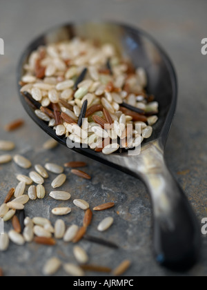 Asian organic red raw rice in the bowl bor cooking Stock Photo - Alamy