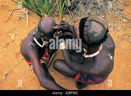 Hamer men decorating their head, Omo river region Ethiopia East Africa ...
