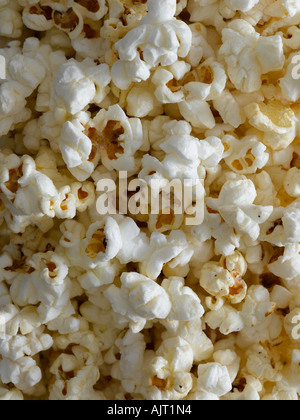 Close-up image of popping popcorn background Stock Photo - Alamy