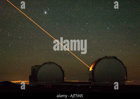A laser beam is projected from the Keck-2 telescope on Mauna Kea to ...