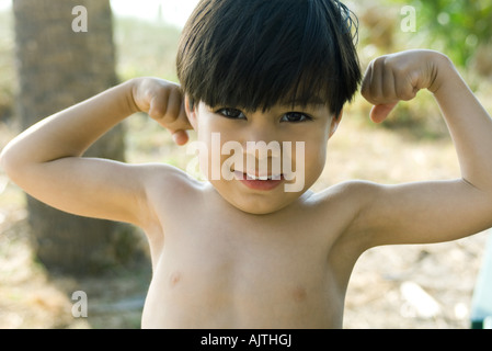 Little boy flexing muscles Stock Photo: 51226244 - Alamy