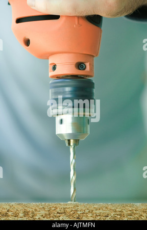 Man using drill, cropped view of hands Stock Photo - Alamy