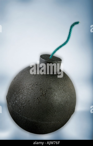 An old fashioned style round bomb with a lit fuse about to explode ...