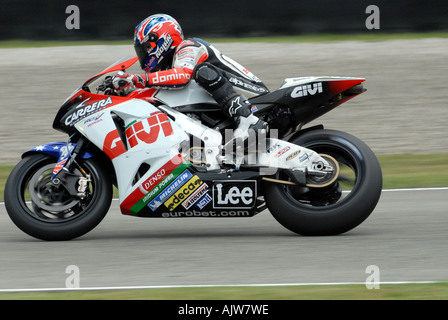 Australian world champion Casey Stoner holds the winner's trophy after ...