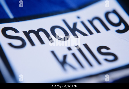 Cigarette packet with warning about smoking and heart attacks and UK ...