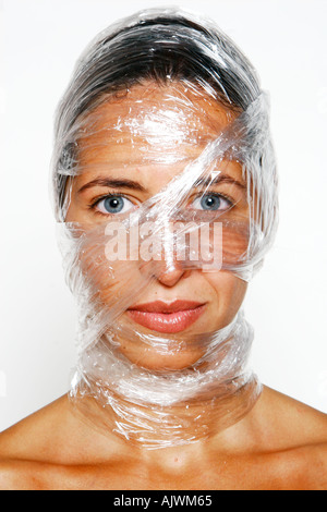 woman with cling film wrapped around her head Stock Photo - Alamy