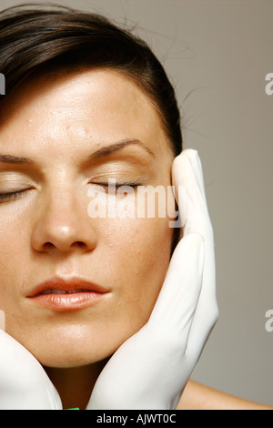 Person in latex gloves holding small chicken Stock Photo - Alamy