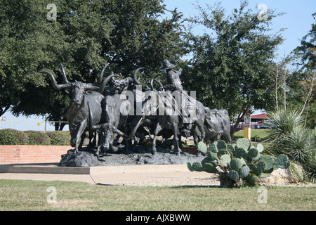 Bronze statue of Texas Longhorn Cattle being herded by a cowboy on ...