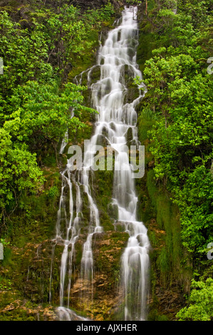 A dramatic waterfall cascades down the north coast of Tanaga Island in ...