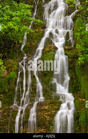A dramatic waterfall cascades down the north coast of Tanaga Island in ...