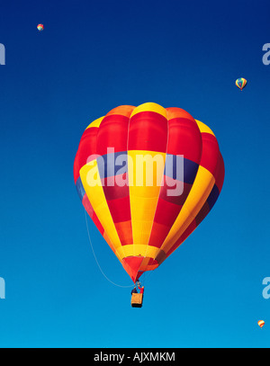Two of five hot air balloons are launched as the sun rises over ...