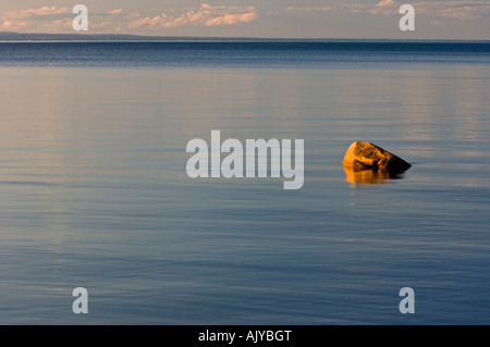 Boulder in calm Bay of Chaleur, Pokeshaw Municipal Park, Pokeshaw, NB ...