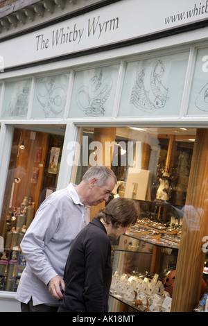 People shopping in Whitby market place and the Old Town Hall, North ...