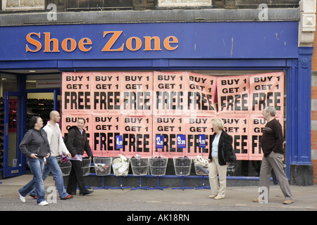 People shopping in Whitby market place and the Old Town Hall, North ...