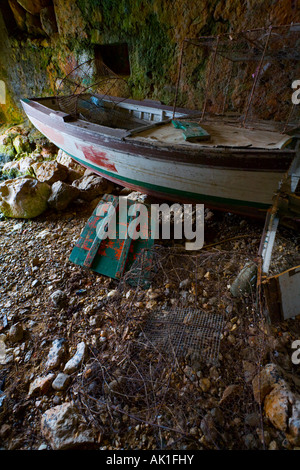 Rotten wooden boat in underground shelter Stock Photo - Alamy