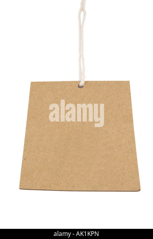 Blank price tag label over brown knit wool fabric background closeup ...