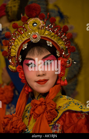 Vertical closeup portrait of female mime performer looking at camera ...