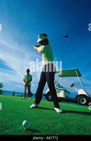 Philippines. Luzon. Bataan. Anvaya Cove. Men playing golf Stock Photo ...