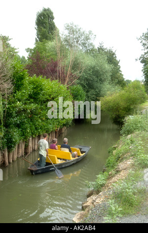 Scenic shot of people boating in a lake in Slovenia surrounded by ...