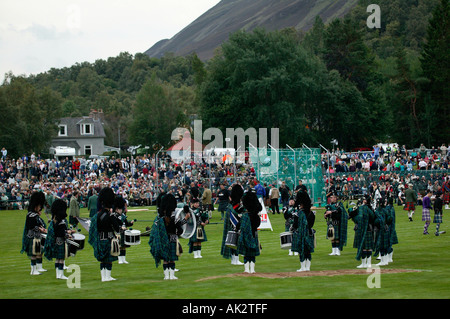 Braemar Gathering Highland Games pipe band marching with audience in ...
