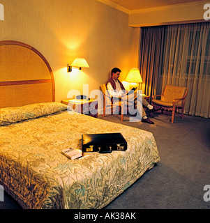 Young man in a hotel room taking a selfie Stock Photo - Alamy