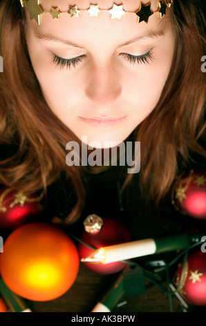 Young brunette woman wearing sleep mask and pyjama gesturing with hands ...