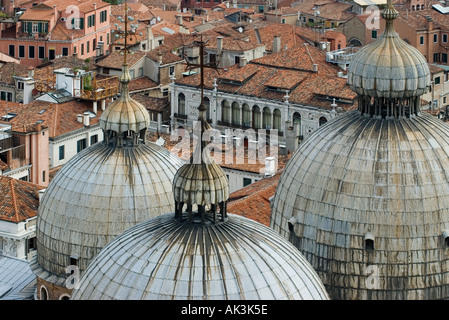 Red tiled rooves of builduings seen beyond the domes of San Marco from ...
