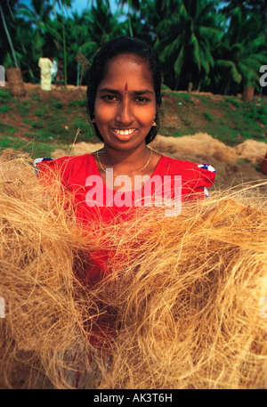 Production of coir or coconut fibres, worker in a factory in Sri Lanka ...